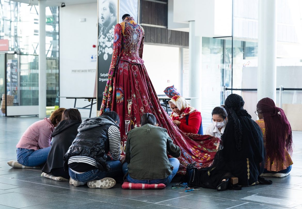 This ornate red dress took 13 years and 353 artists in the making