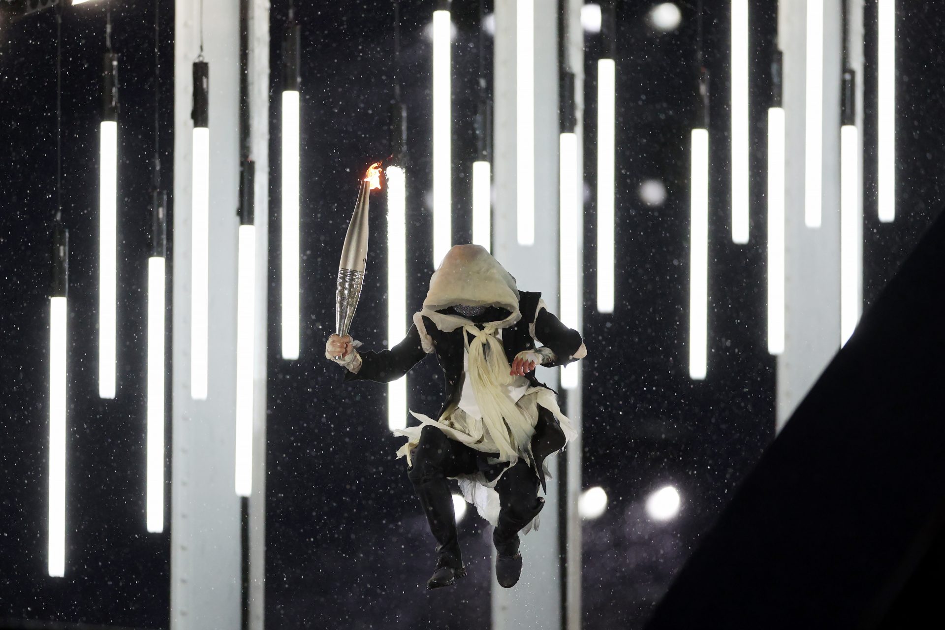 Who is the masked torchbearer 'parkouring' across Paris at Olympics ...